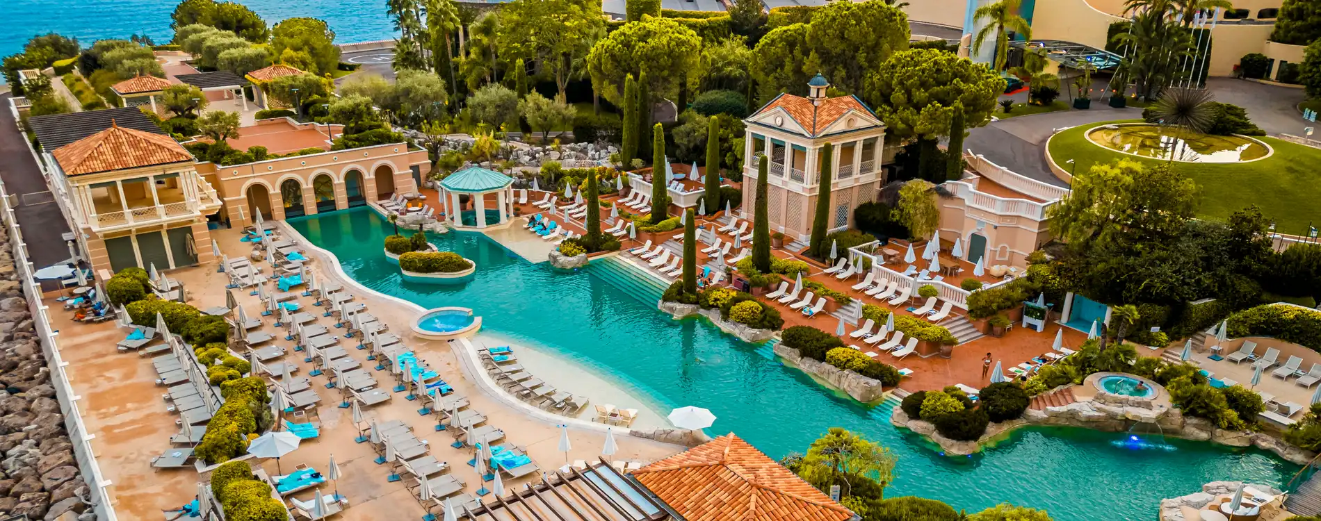 The Monte-Carlo Bay Hotel & Resort lagoon and seaside location | Monte ...